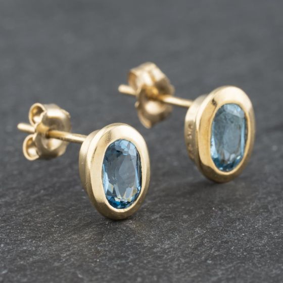 Second Hand Yellow Gold Blue Topaz Oval Rubover Stud Earrings 41172698 ...
